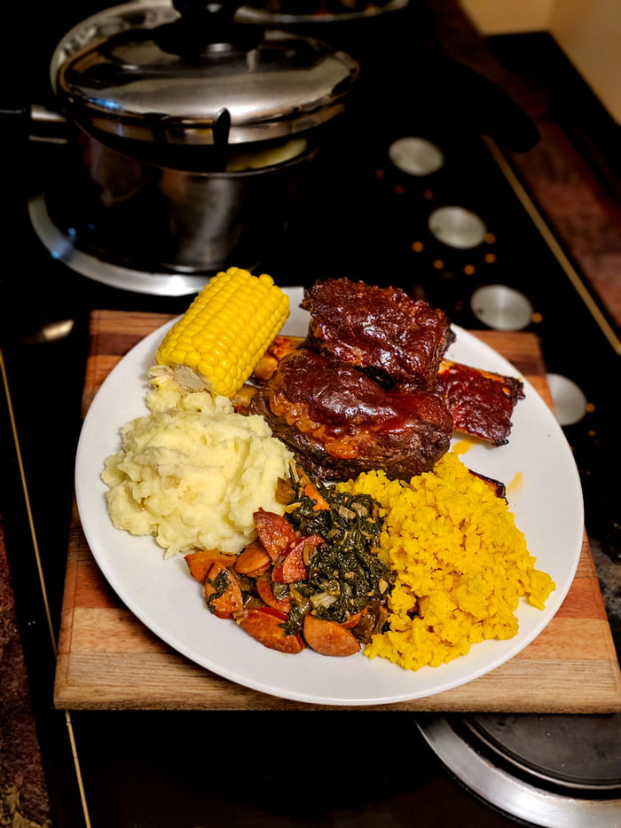 Sticky BBQ beef short ribs, yellow rice, silverbeet with smoked sausage ...