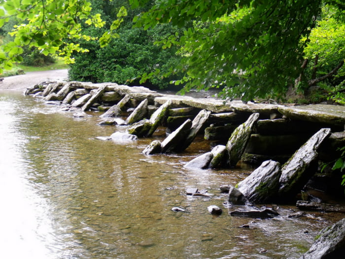Tarr Steps - a clapper bridge in Exmoor National Park, UK. A clapper ...