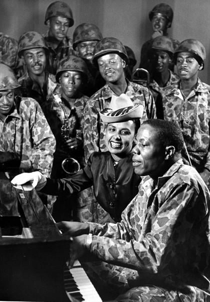 Singer Lena Horne singing next to pianist Silky Hendricks of the 299th ...