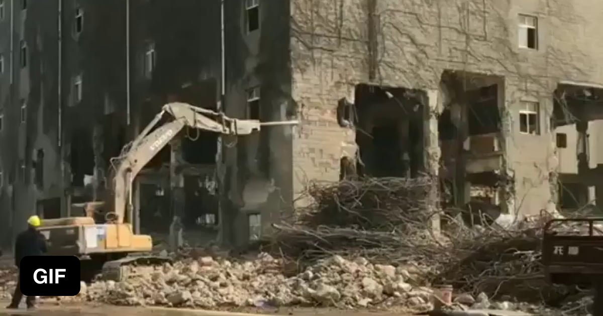 Demolition team using a drill to take down building. - 9GAG