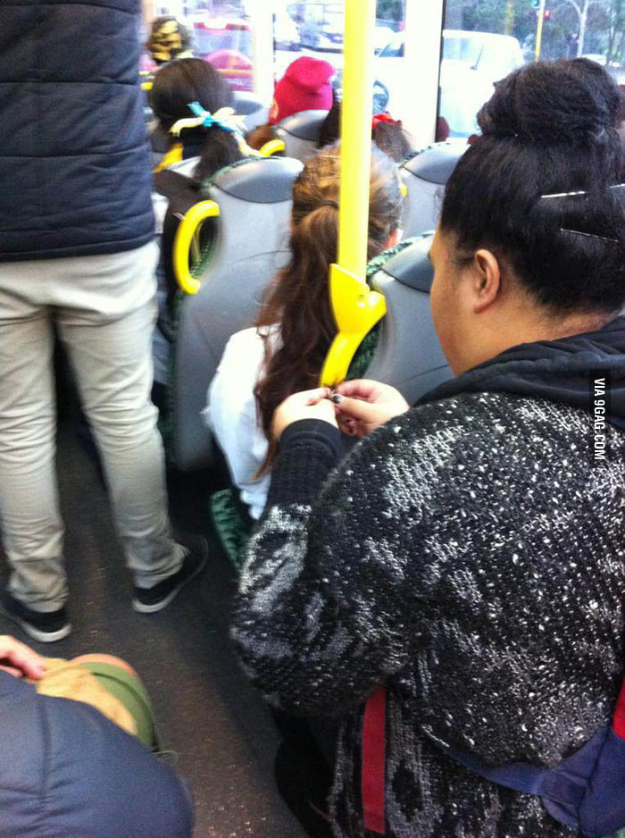 She is tying a random persons hair to the bus rail... - 9GAG