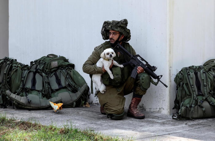 IDF Solider rescue a dog after him family was murder by Hamas. - 9GAG