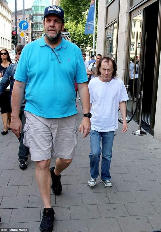 AC/DC legend Angus Young beside his bodyguard in Germany - 9GAG