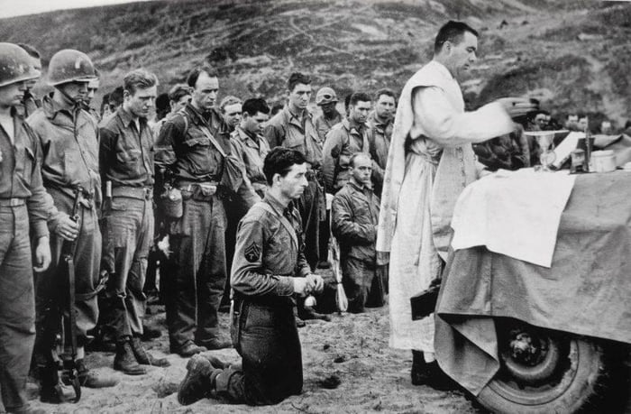 A Catholic priest conducts mass on Omaha Beach, Normandy, France, June ...