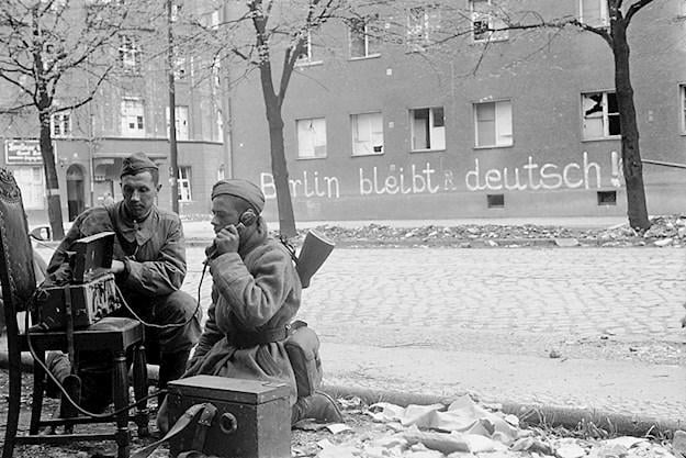 Soviet soldiers operate a radio in house-to-house combat. Berlin, 1/2 ...