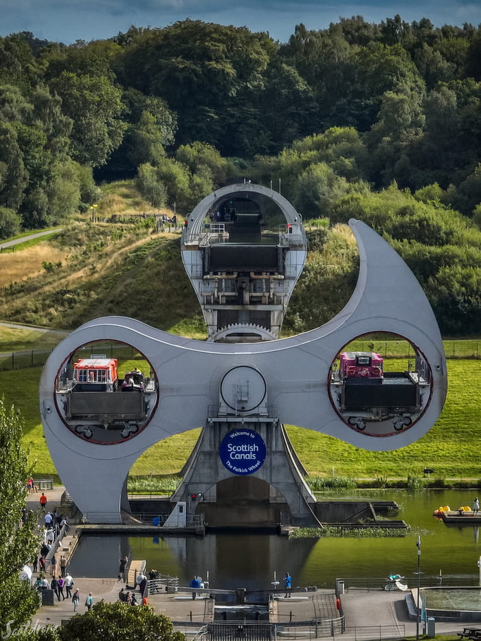 The Falkirk Wheel, a rotating canal boat lift, in the middle of its ...