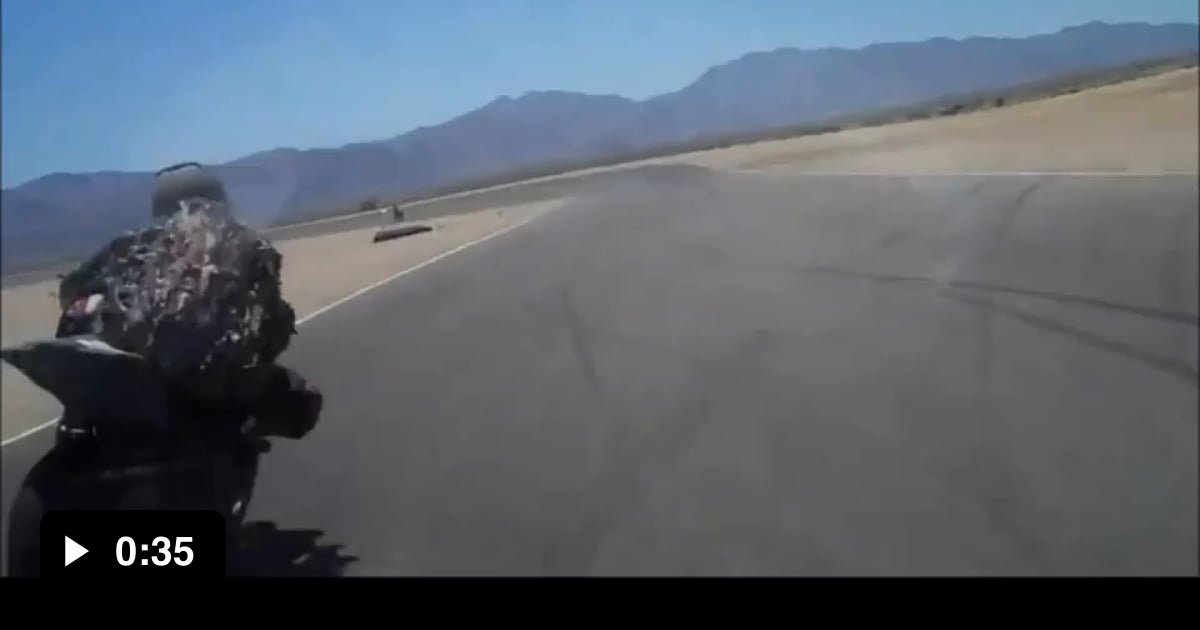 Biker dragging his helmet while cornering - 9GAG