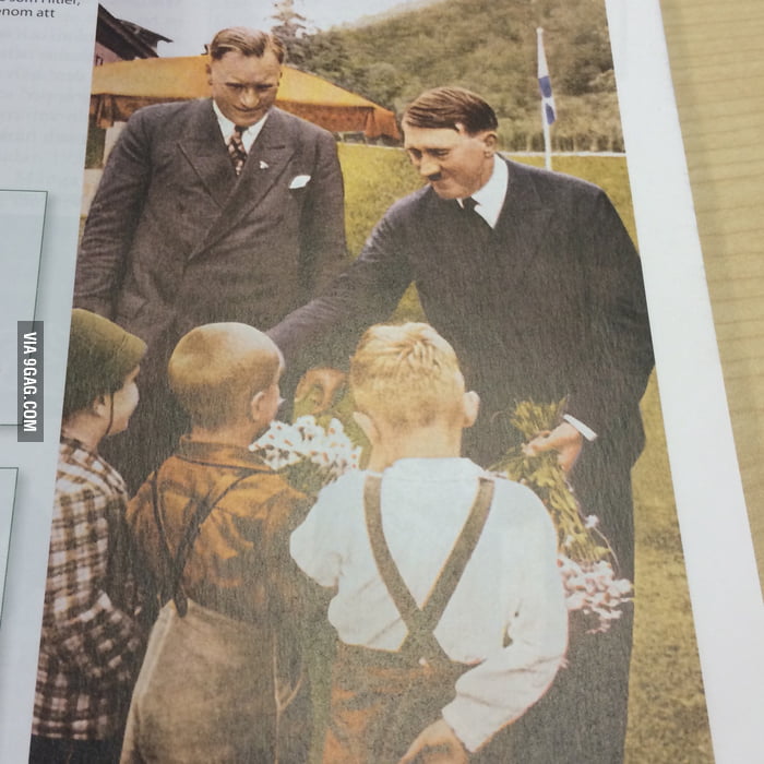 A coloured picture of Hitler giving flowers to children in my history ...