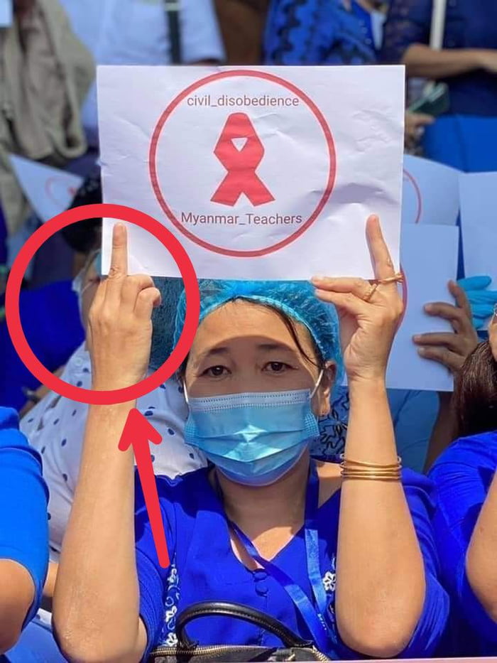 A teacher is teaching sign language during protest. - 9GAG