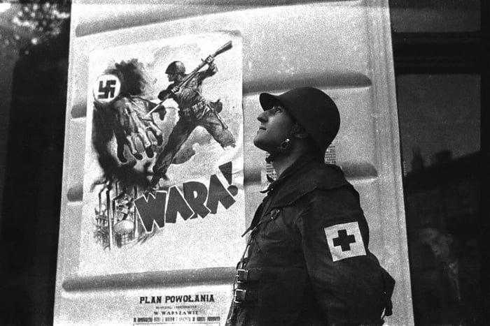 A Polish Army paramedic looks at the sky during the first Luftwaffe air ...