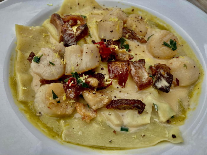 Homemade lemon ricotta ravioli, Marconi pepper and sweet corn coulis ...