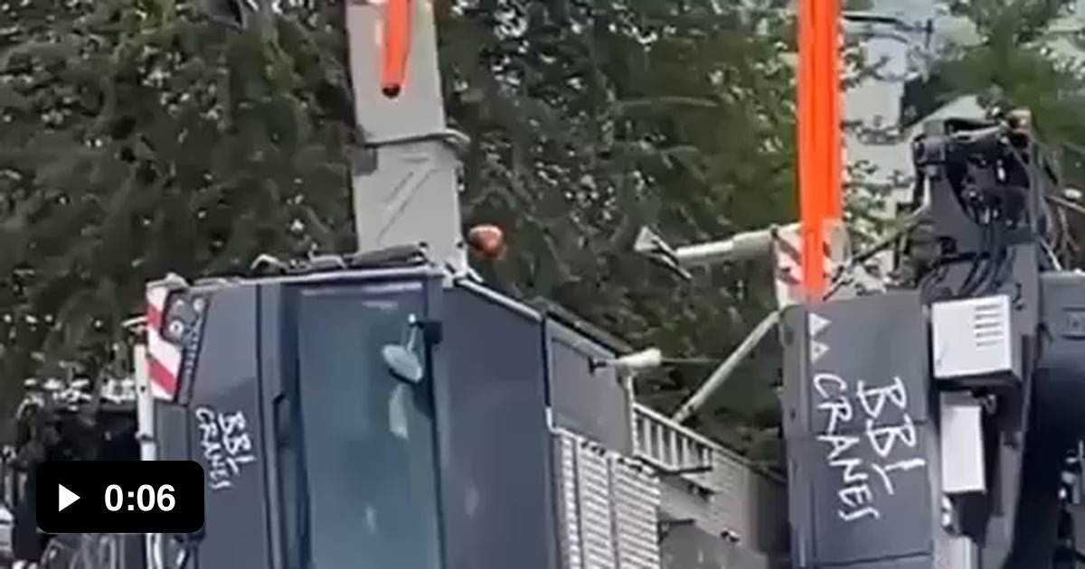 Workers walk away from a falling crane vehicle - 9GAG