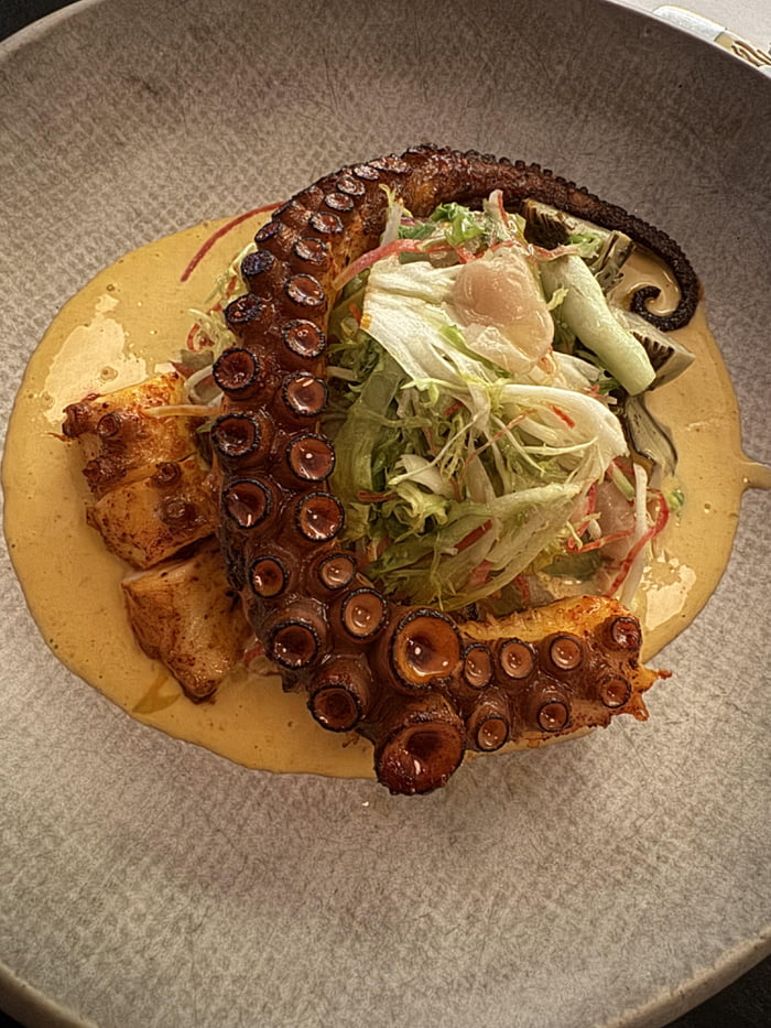 Wood fired Octopus frisée salad - 9GAG