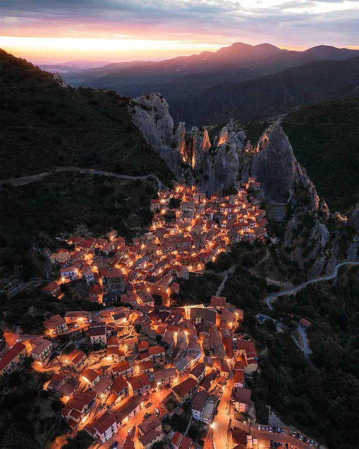 This village nestled in the mountains looks absolutely magical at dusk. - 9GAG