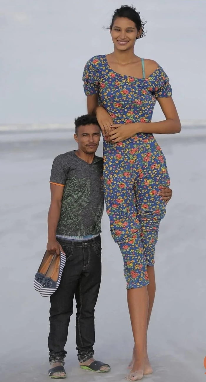 One of the Tallest Females in the World with her Husband... - 9GAG
