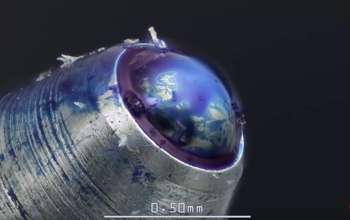 This is what the tip of a ball point pen looks like under a microscope ...