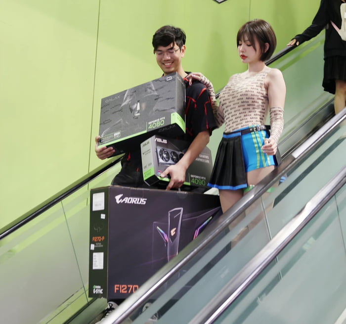 Photos of a guy with gpu's with a chick next to him while going down on an elevator is a thing ...