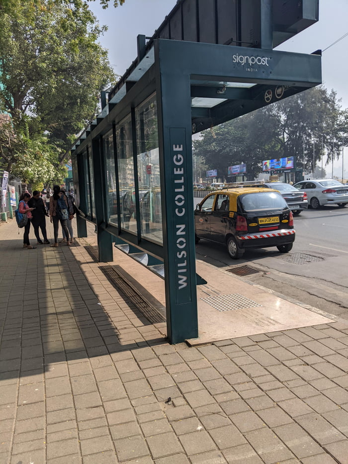 Bad design. A bustop with no shade on seats. People stand behind to ...