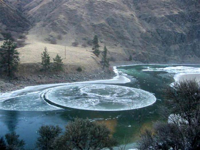 An eddy is formed when a river flows past a large solitary object, such ...