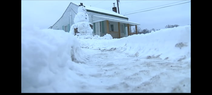 Someone tried to destroy a snowman but there was a tree trunk inside ...