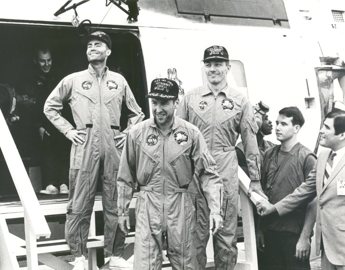 Apollo 13 astronauts Fred W. Haise, Jr., James A. Lovell Jr., and John ...