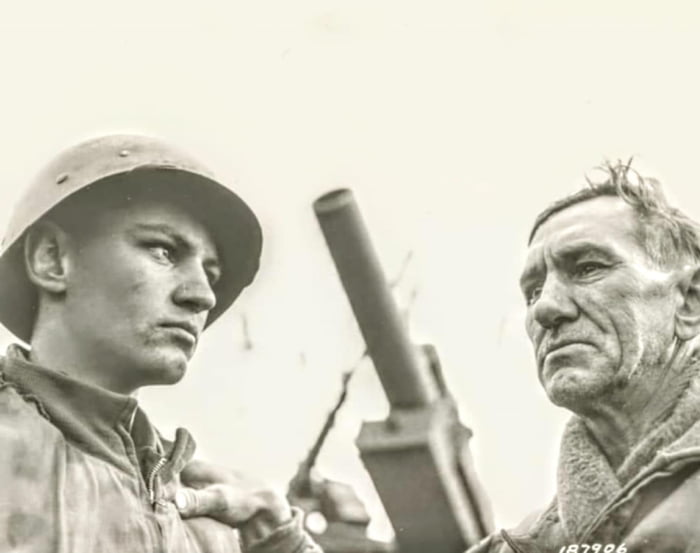 Father and son GIs- Pvt. William R. Loop of Binghamton, N.Y., and his father, Cpl. Roderick R ...