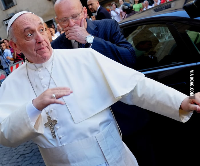 The Pope just about to lay some fresh pontifical moves as the bodyguard ...
