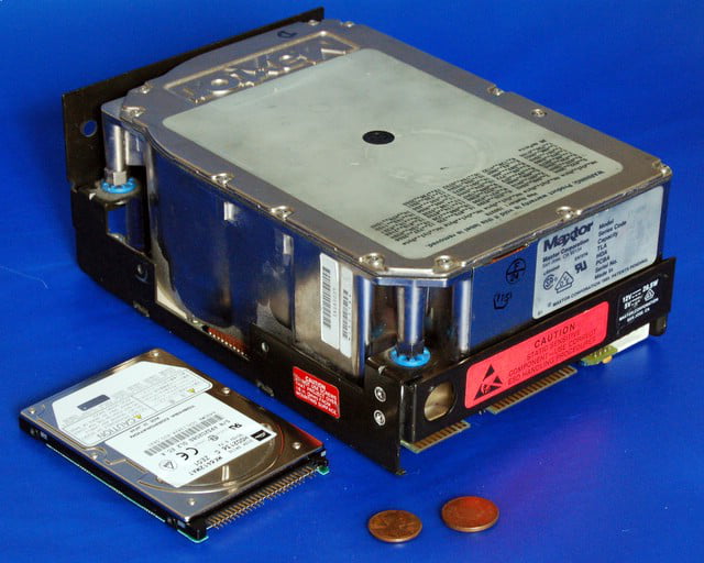5 megabyte hard drive from 1980 next to a notebook drive - 9GAG