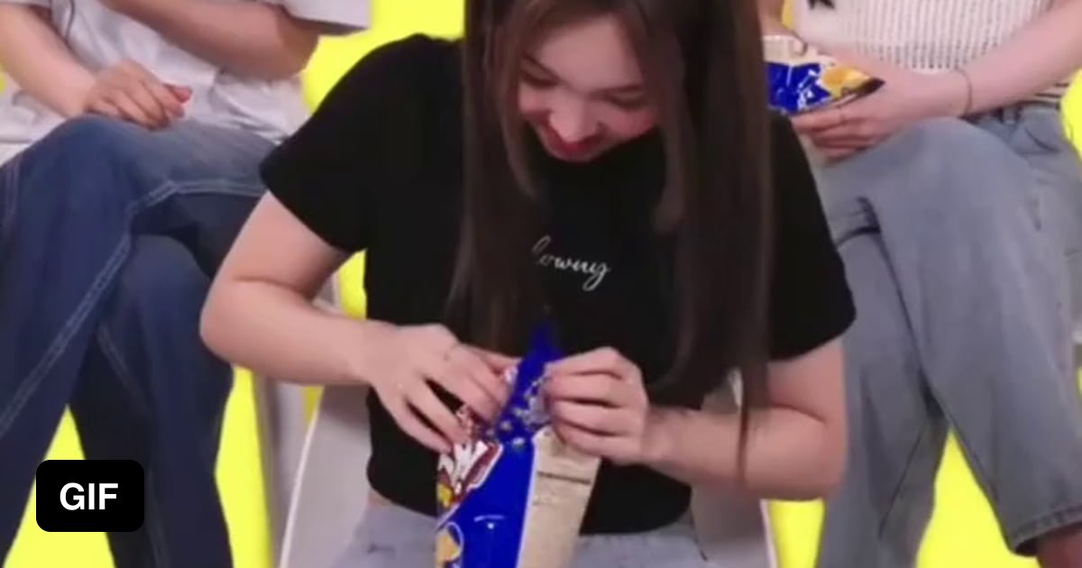 Nayeon struggling to open a snack - 9GAG