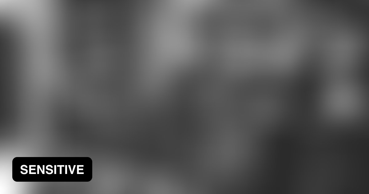 Soviet military personnel look at the remains of cosmonaut Vladimir ...