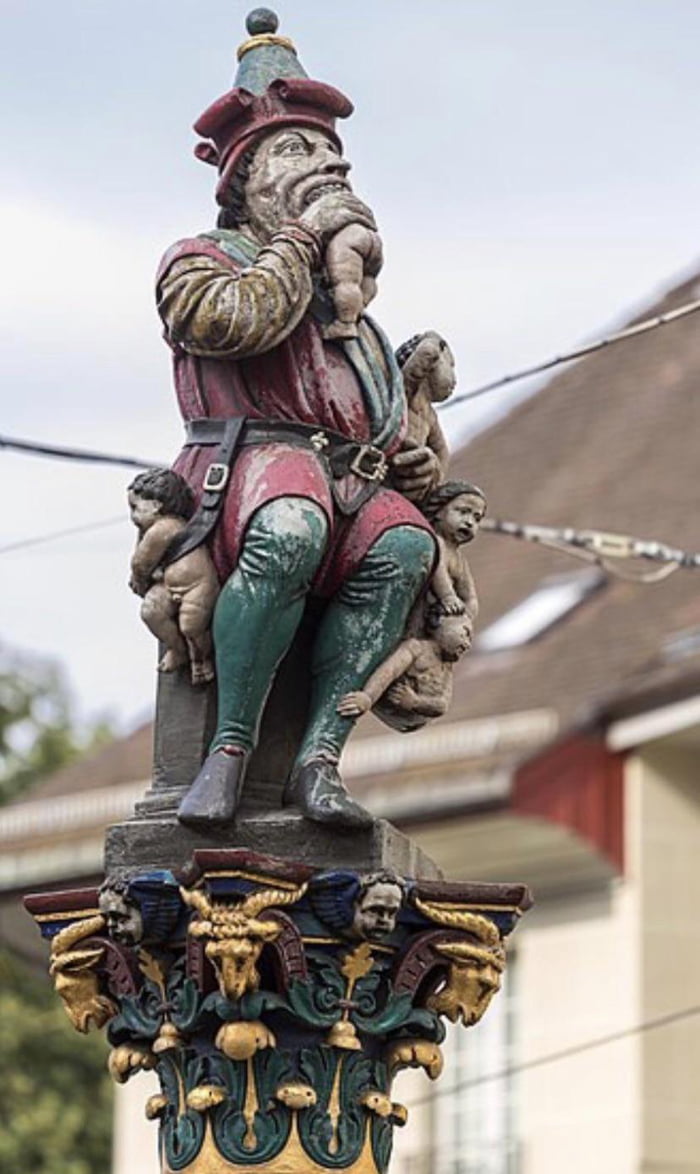 This 500 year old statue in Switzerland that depicts a man eating a ...