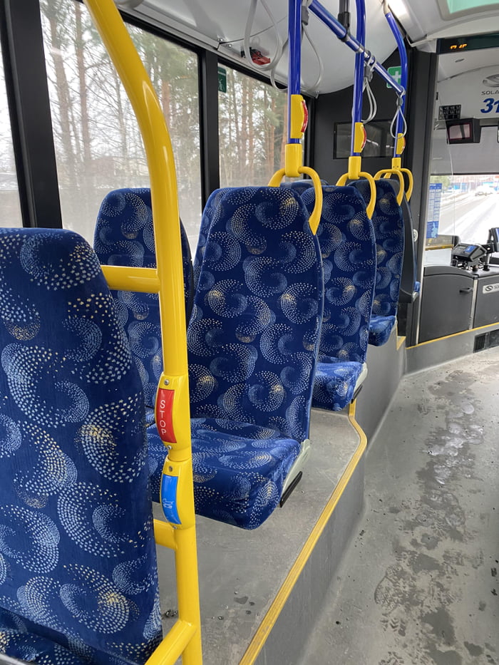 Row of bus seats facing the wrong way - 9GAG