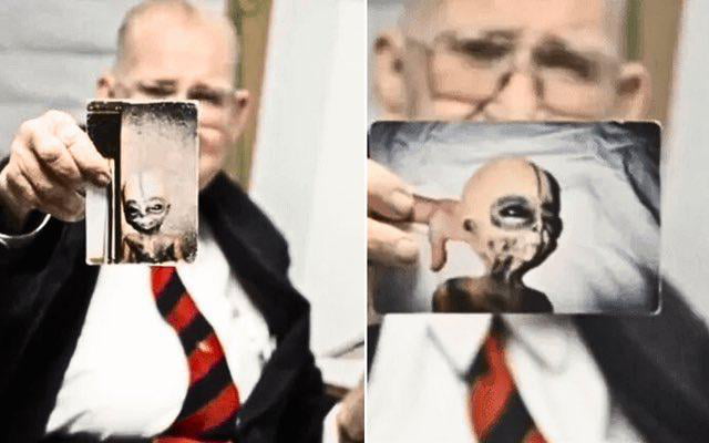 Lockheed scientist Boyd Bushman shows a series of photographs of an ...