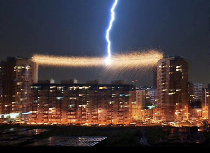 Lightning striking an electrical wire between two buildings - 9GAG