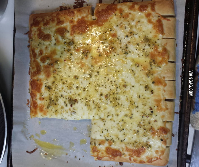 Greasy yet extremely delicious garlic & herb cheesy bread hot out of ...