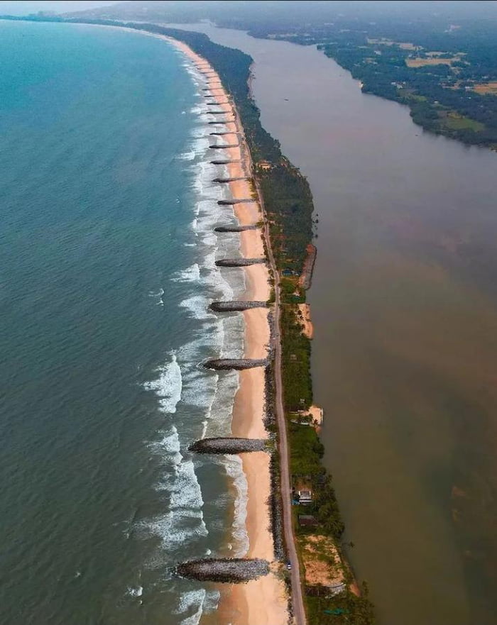 Beautiful stripe of land between a river and sea in Udupi in Karnataka ...