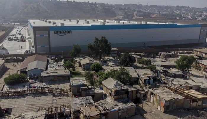 Amazon warehouse next to Tijuana slums - 9GAG