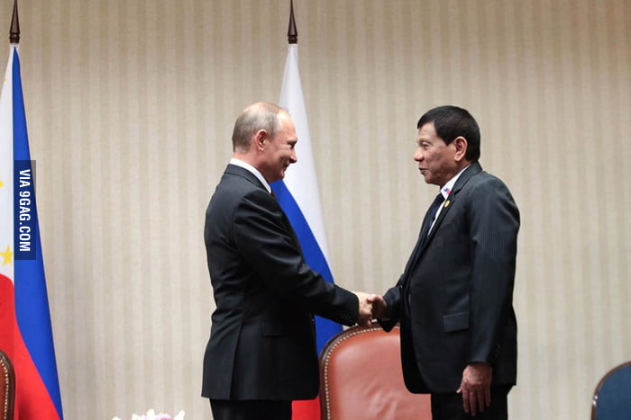 A rare smile from Russian President Vladimir Putin while meeting ...