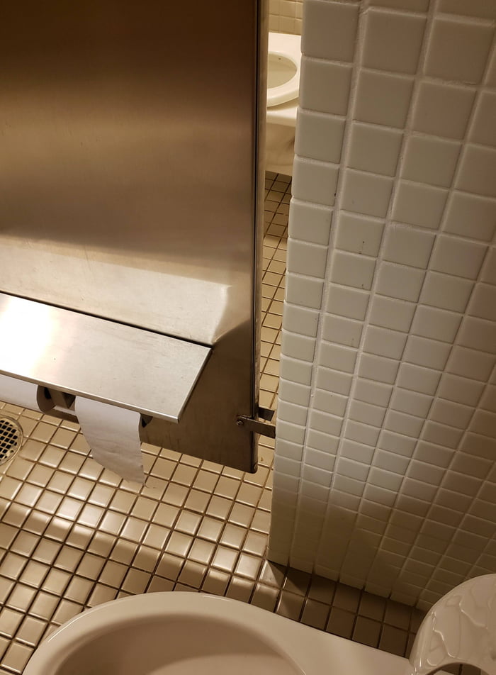 This gap that lets you watch the guy in the next stall while you're ...