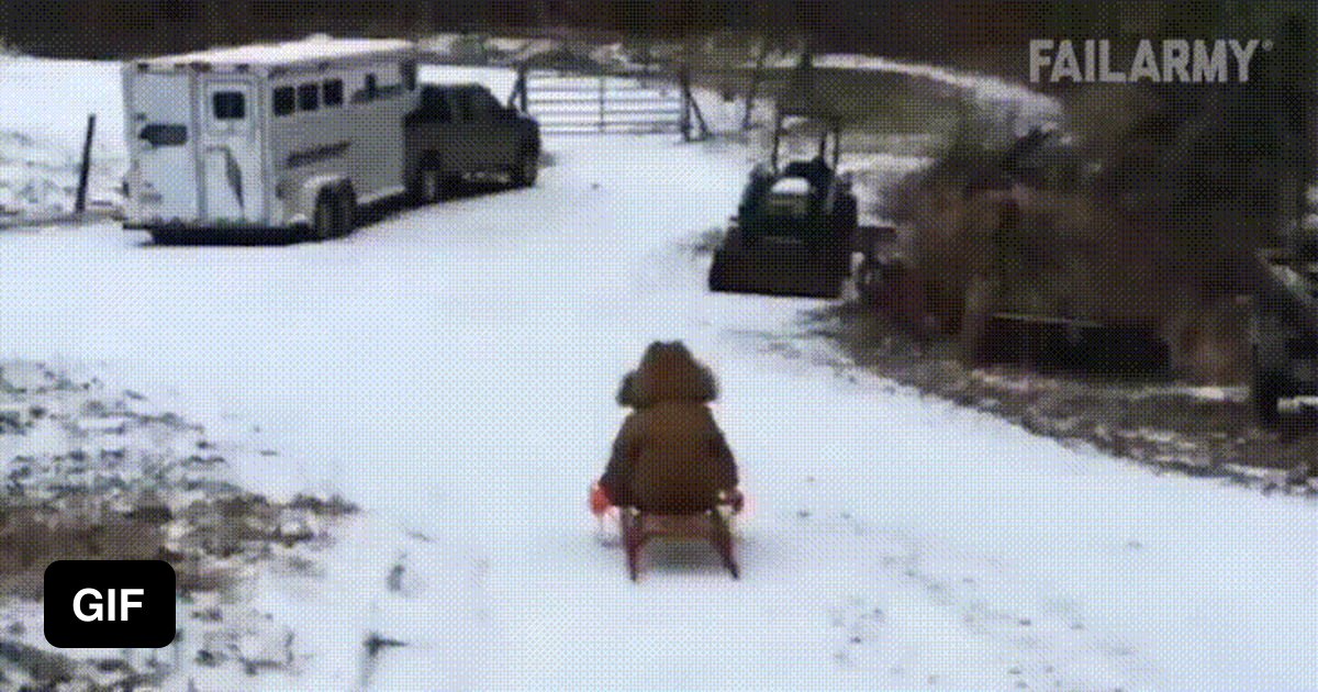 Kid goes sledding down the hill into a car trailer. - 9GAG