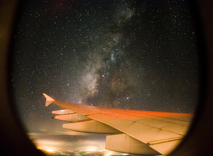 The Milky Way from a plane window at 40,000ft - 9GAG