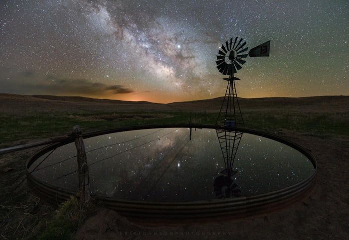 The Milky Way reflected in a windmill's water tank. This is a shot I've ...