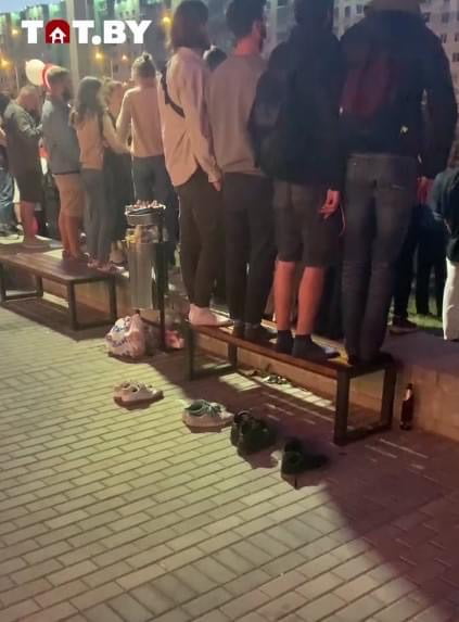 Protests in Belarus. People take off their shoes before stepping up on ...