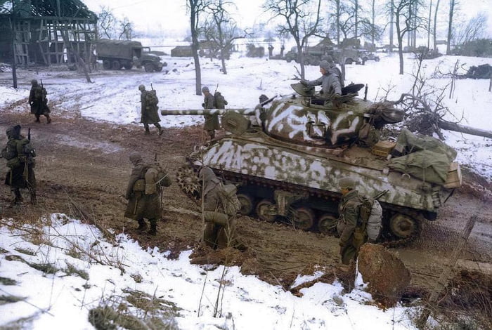 A snow-camouflaged M4A3 76w Sherman tank with a 76mm gun, belonging to ...