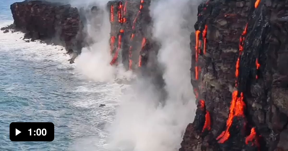 Lava drips over the sea cliffs in Hawaii. This metal display of nature ...
