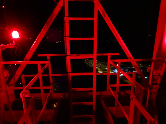 Climb on a tower in the night, 215 meters tall. - 9GAG