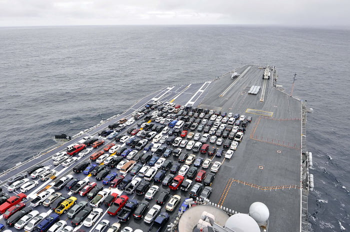 Cars parked on an aircraft carrier flight deck - 9GAG