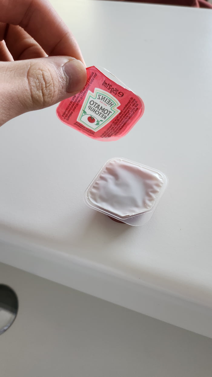 Heinz Ketchup with a pull tab that pulls 2 layers apart from each other ...