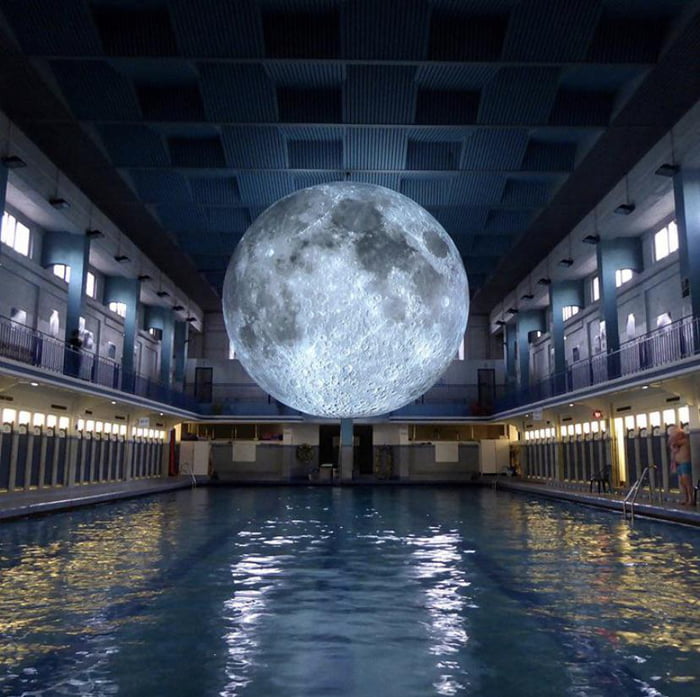 The art installation “Museum of the Moon” at a swimming pool in Italy ...