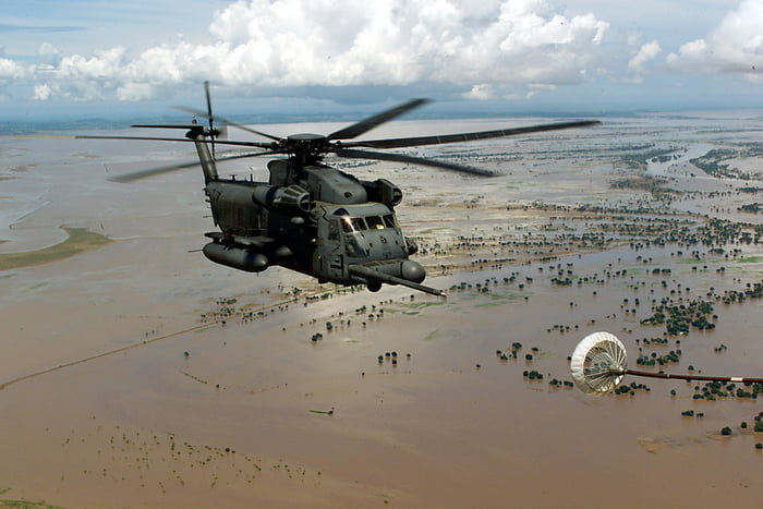 A US MH-53M Pave Low IV helicopter flying over the flooded Limpopo ...